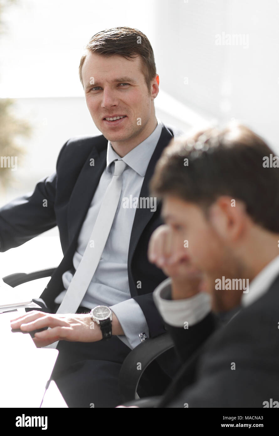 Boss sitting behind desk hi-res stock photography and images - Alamy