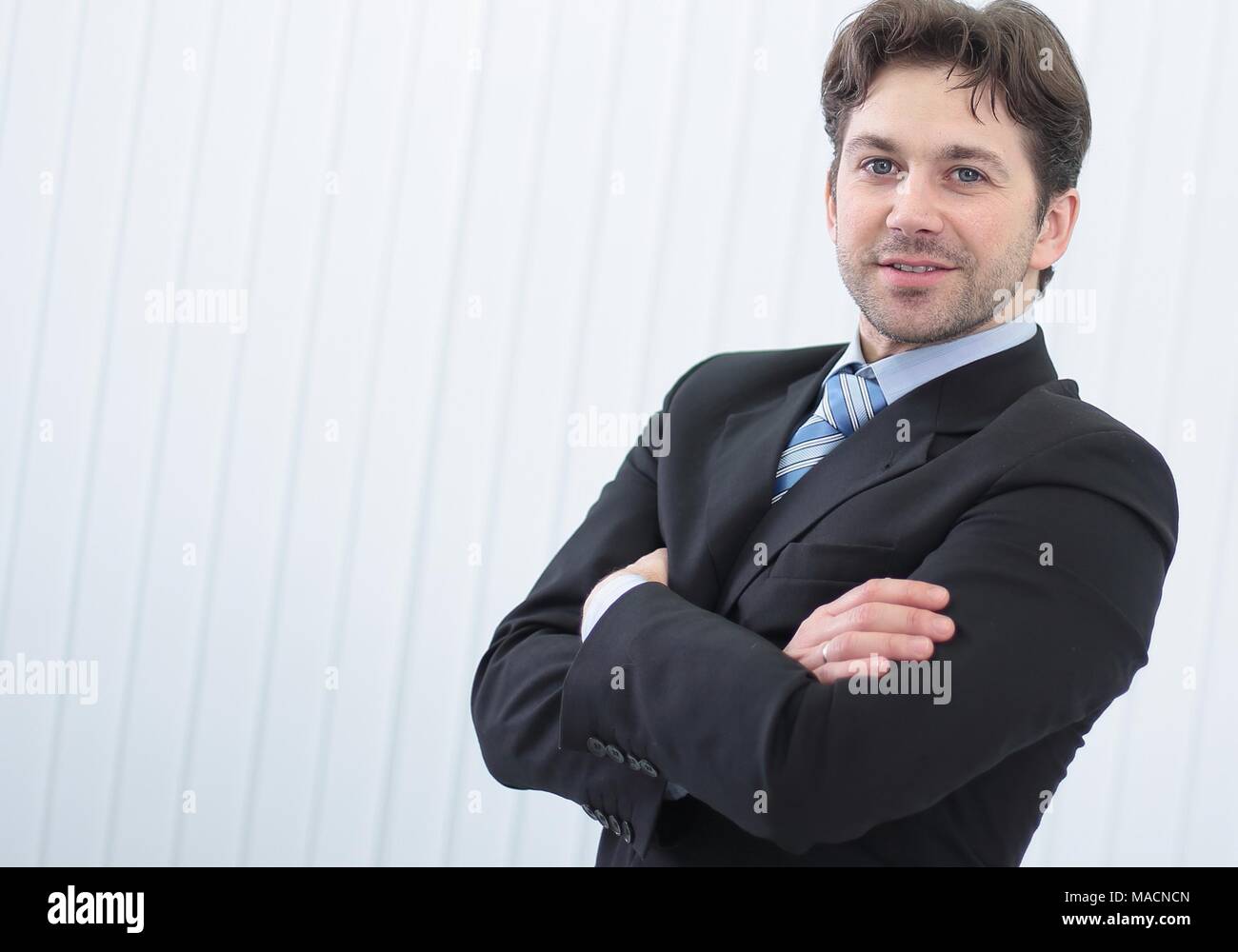 Portrait of happy smiling young businessman Stock Photo - Alamy
