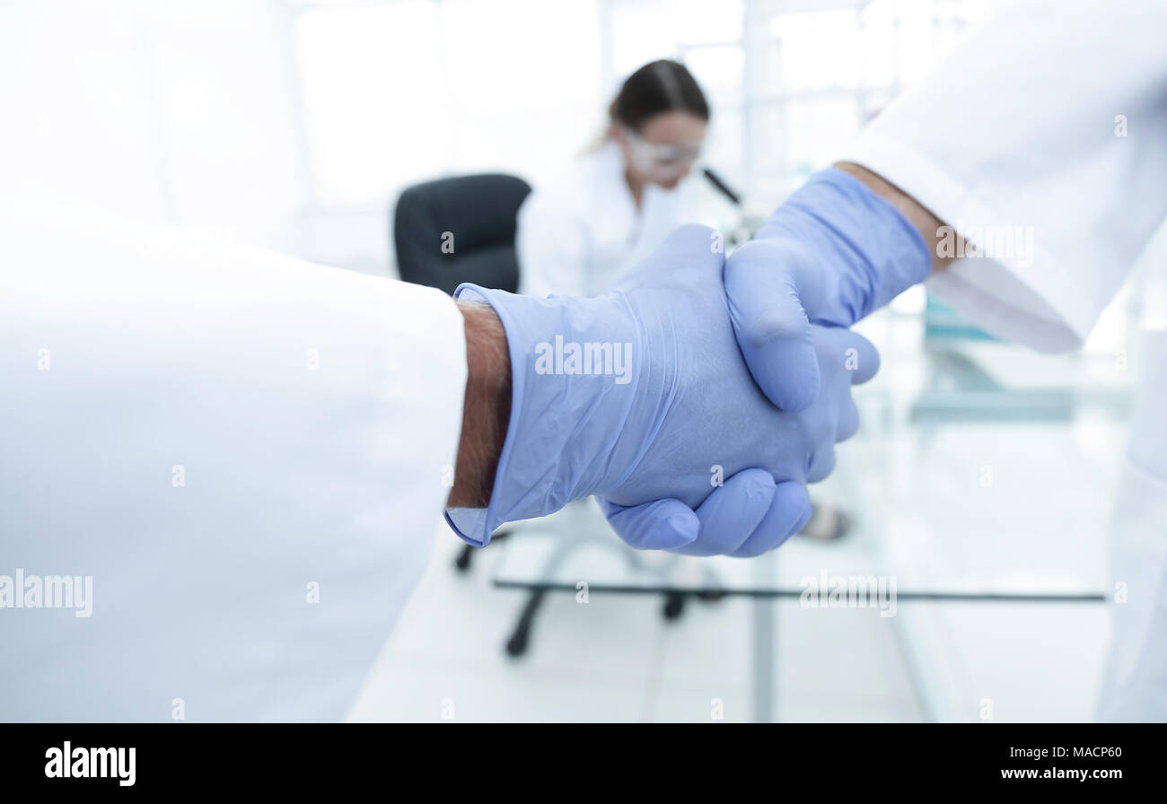hand in the medical glove (handshake Stock Photo - Alamy