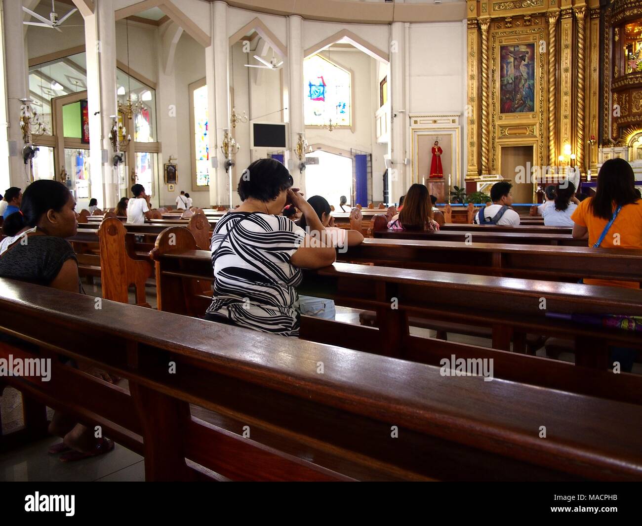 Filipino Praying In Church