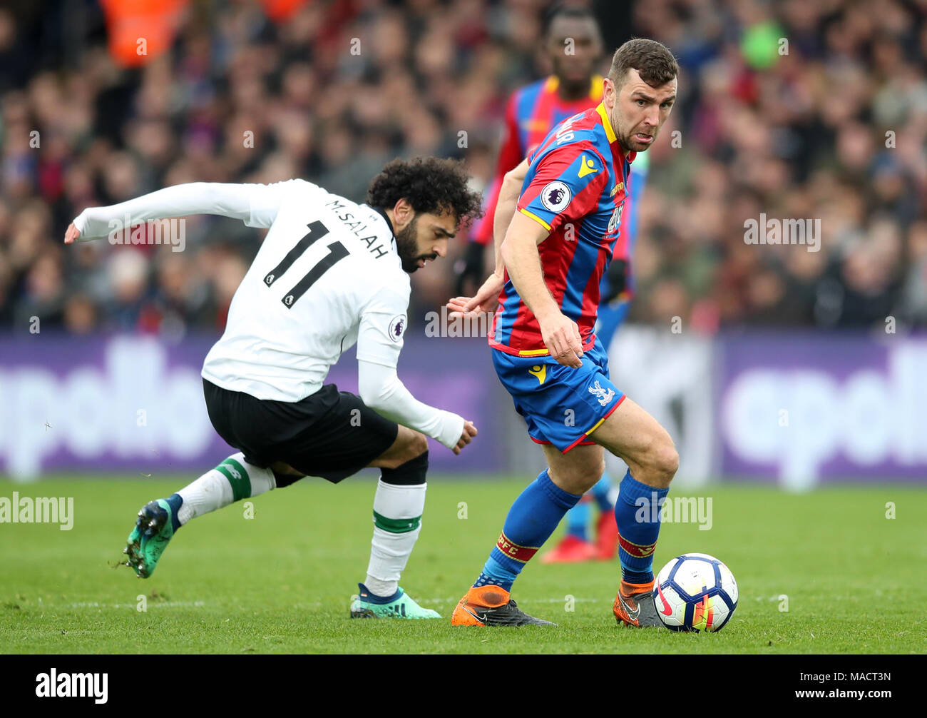 Liverpool's Mohamed Salah (left) and Crystal Palace's James McArthur ...