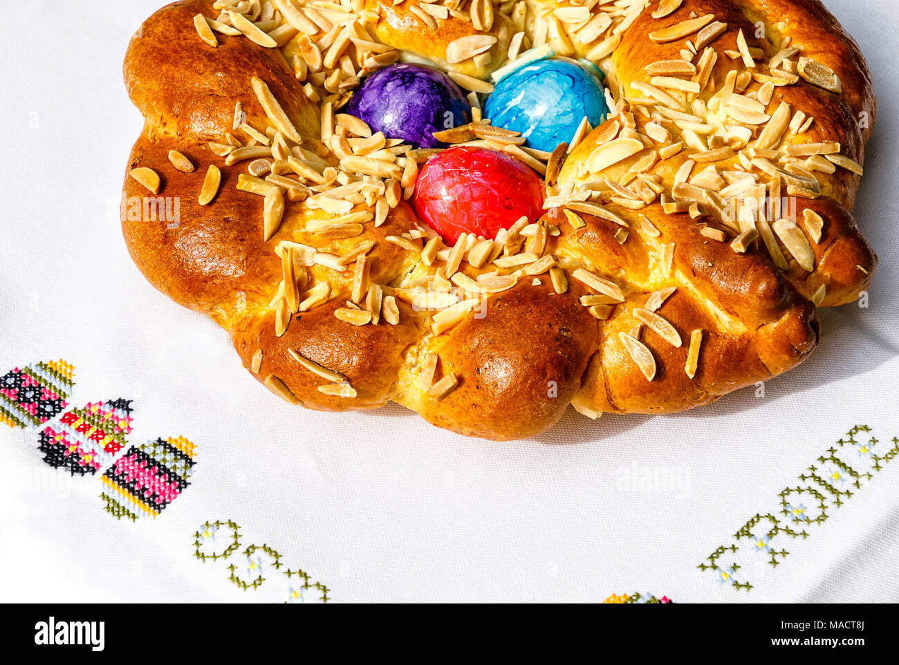Homemade Easter traditional bread decorated with colorful eggs, festive ...