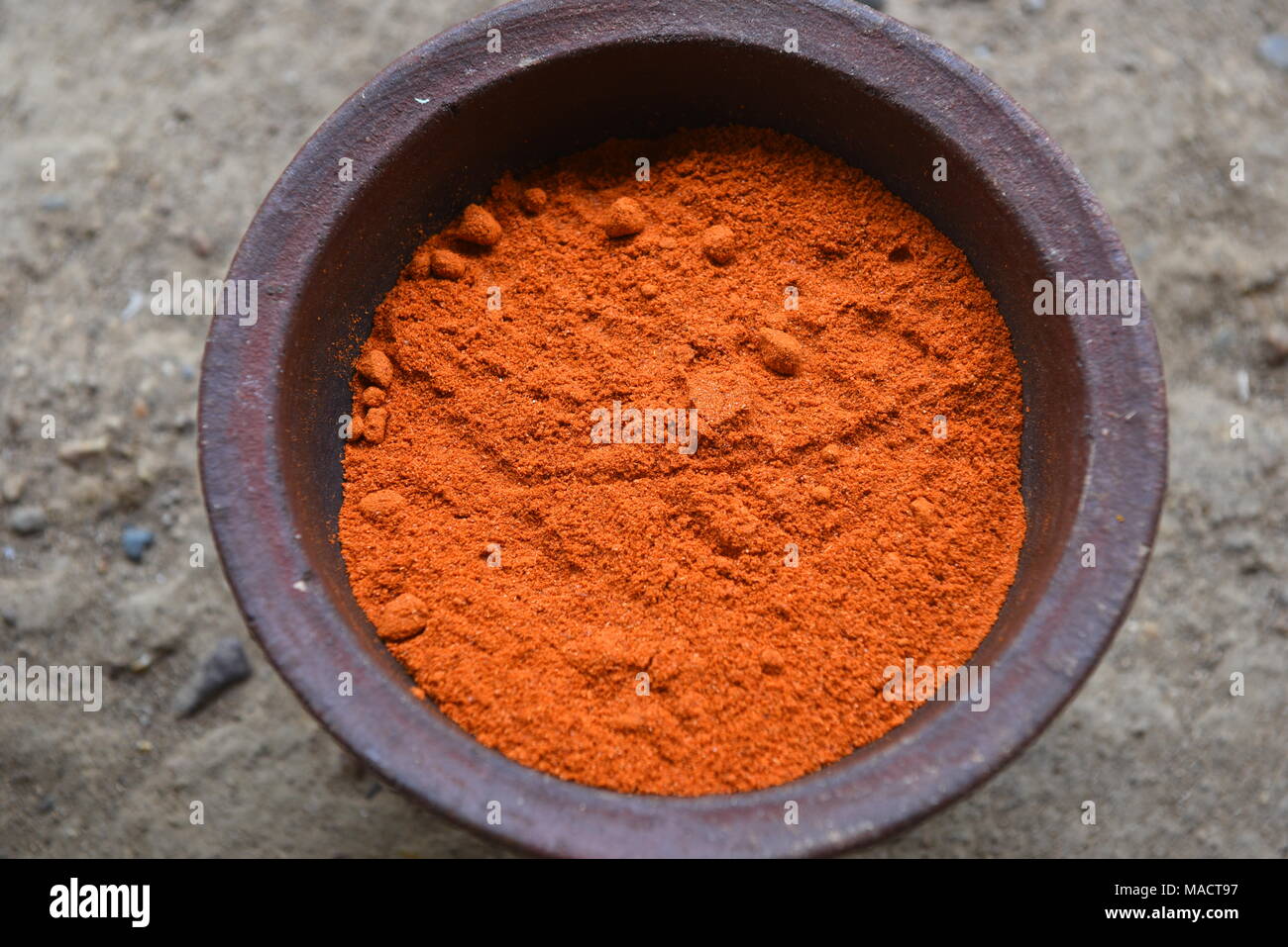 Red Chili Powder in clay pot Stock Photo - Alamy