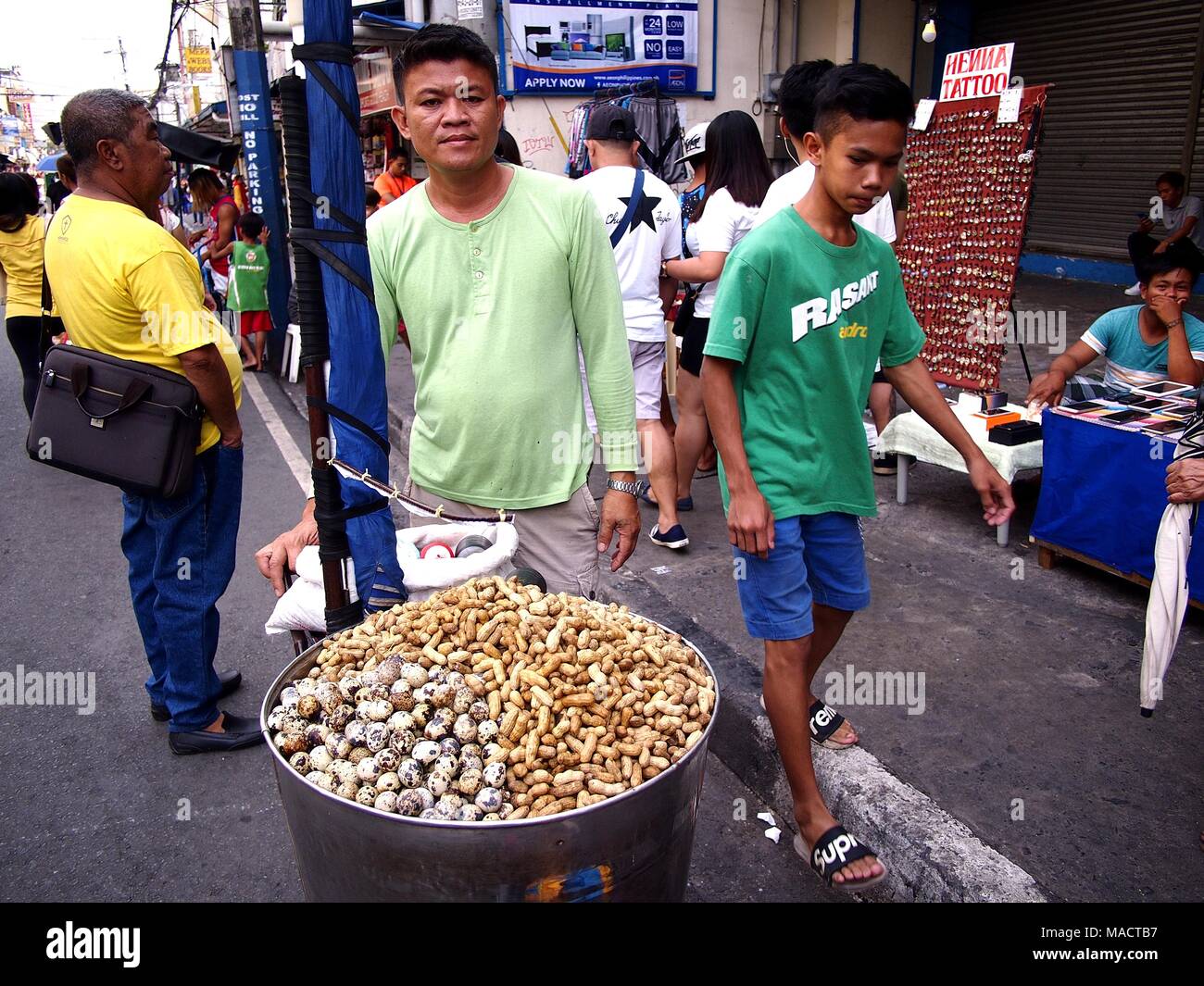 ANTIPOLO CITY, PHILIPPINES - MARCH 29, 2018: A street vendor sells ...