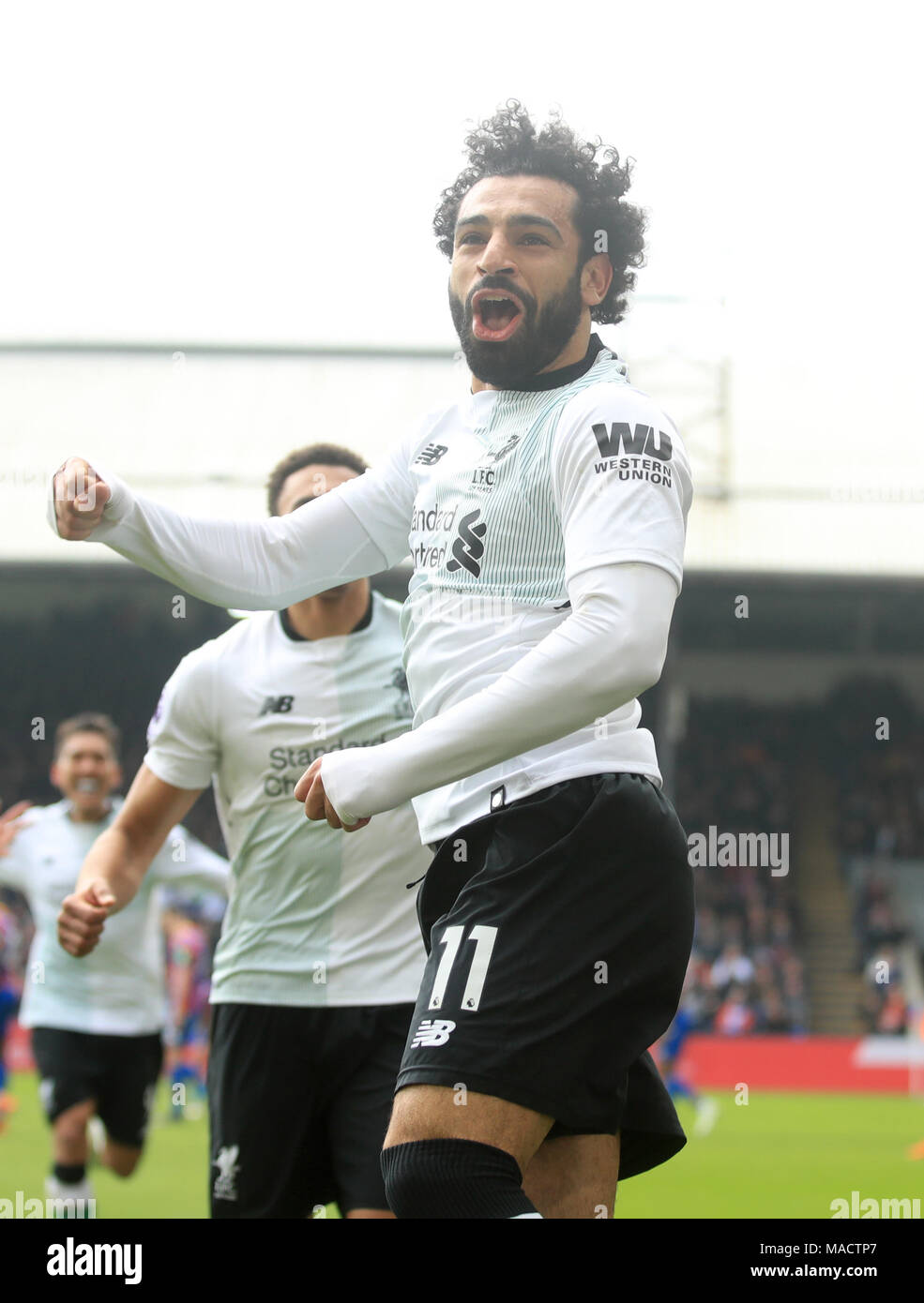 Liverpool's Mohamed Salah celebrates scoring his side's second goal of ...