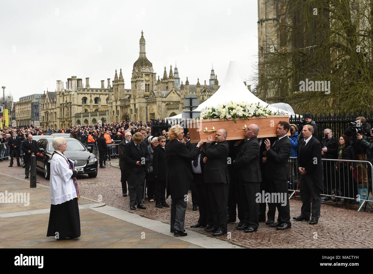 Relatives and family members wait as the coffin of Professor Stephen ...