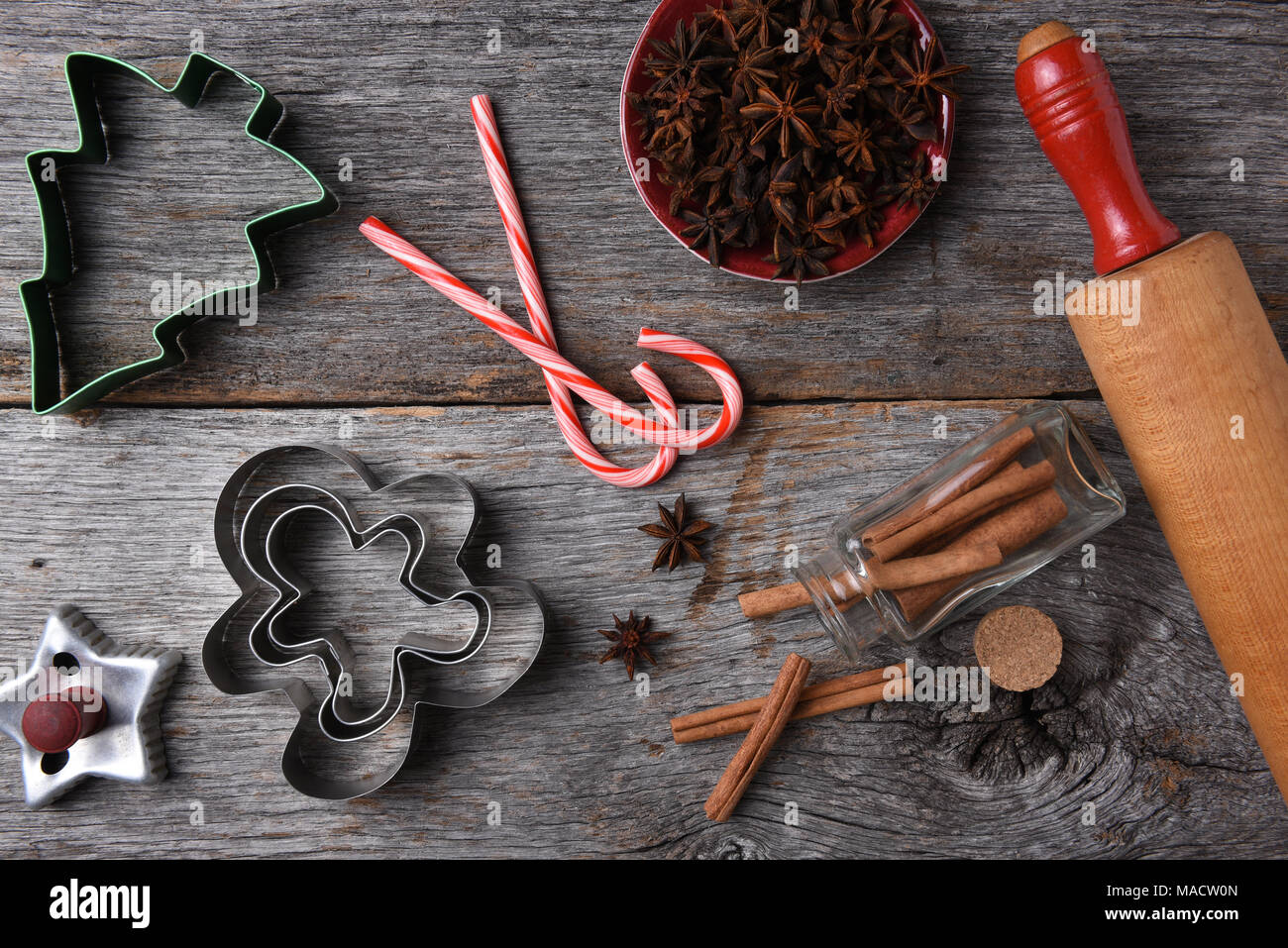 Overhead view of a holiday baking still life on a rustic kitchen table ...