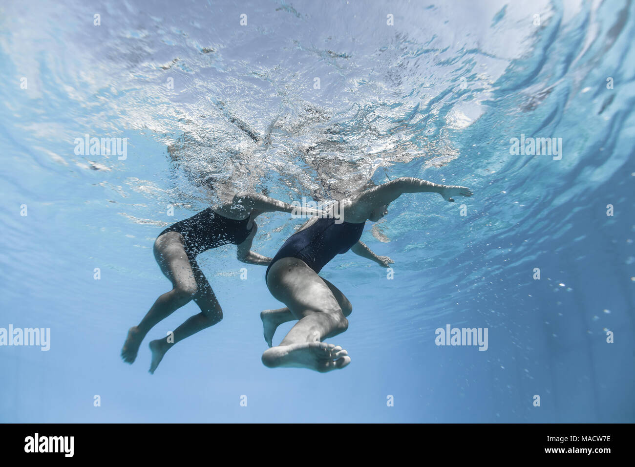 Synchronized swimmers underwater hi-res stock photography and images ...