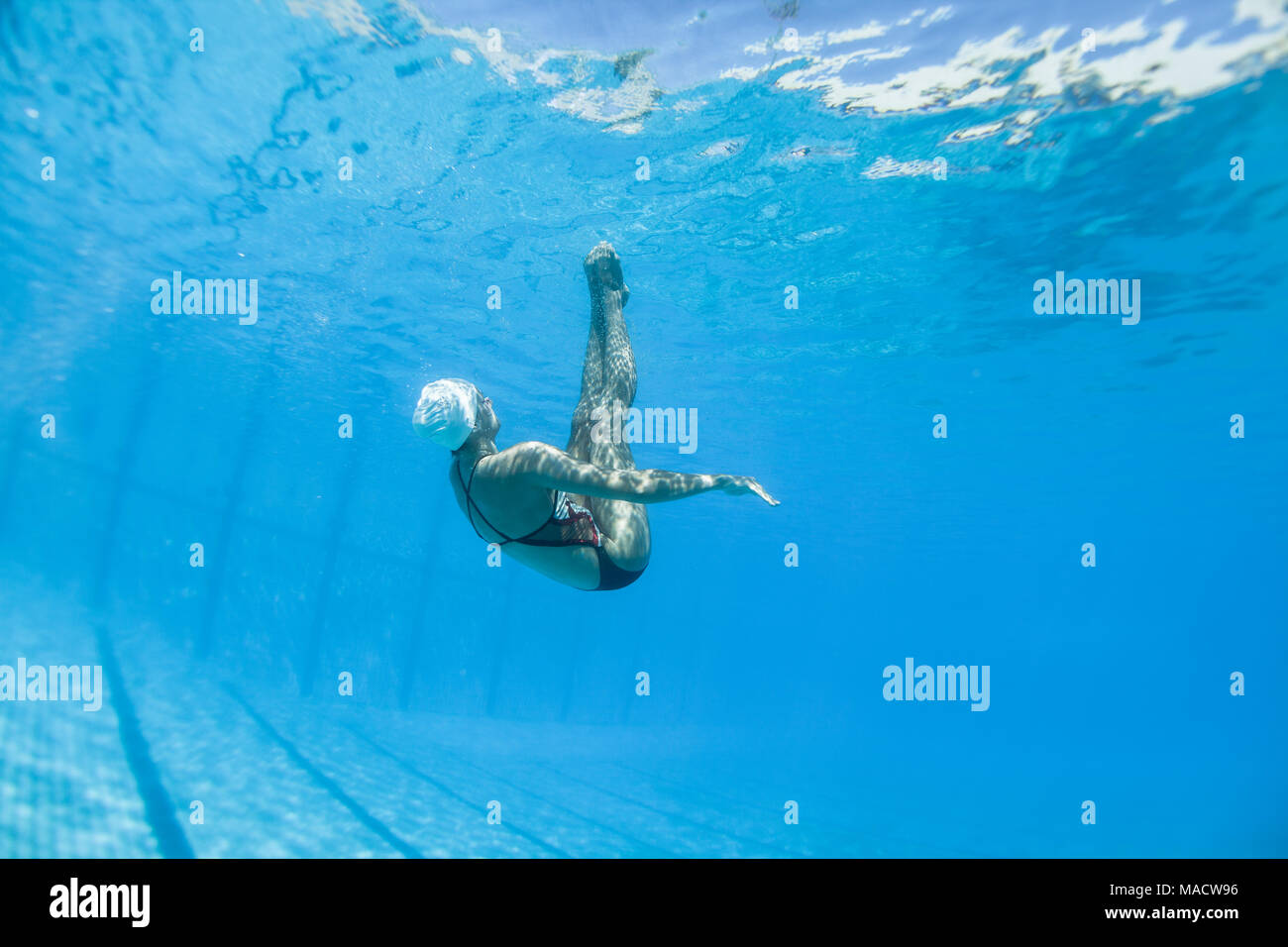 Synchronized swimmers underwater hi-res stock photography and images ...