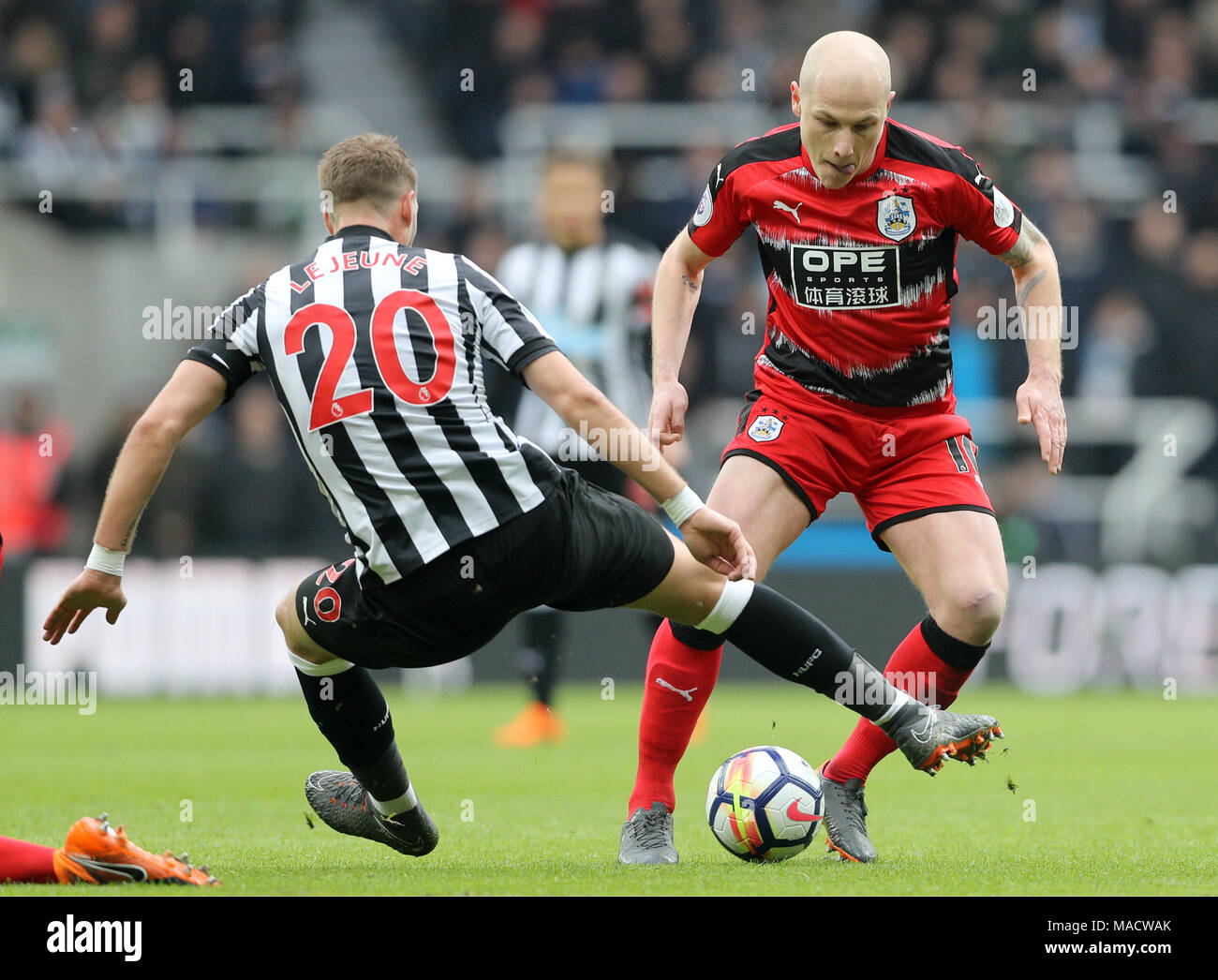 Newcastle United's Florian Lejeune (left) and Huddersfield Town's Aaron ...