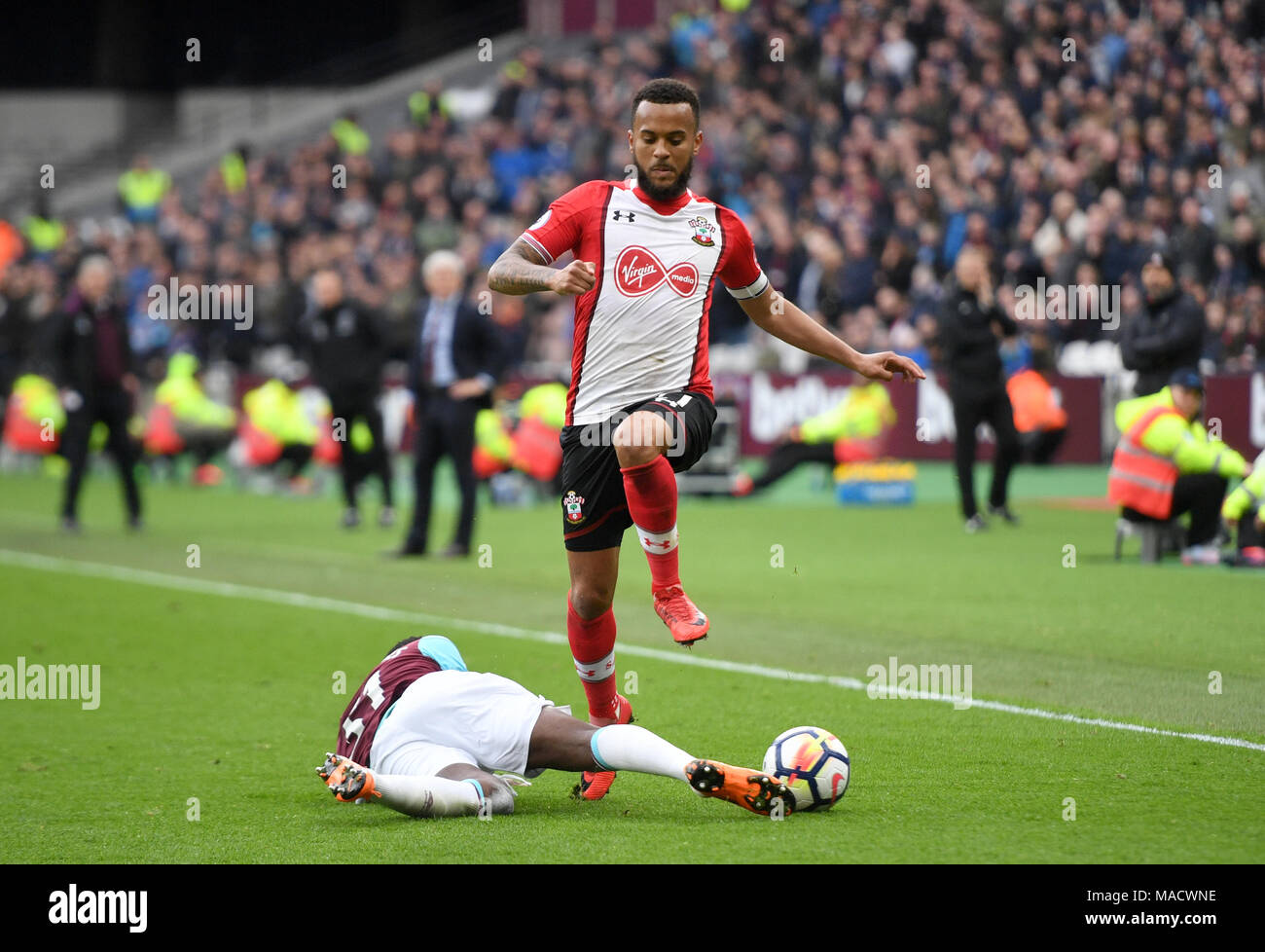 Southampton's Ryan Bertrand jumps over West Ham United's Edimilson ...
