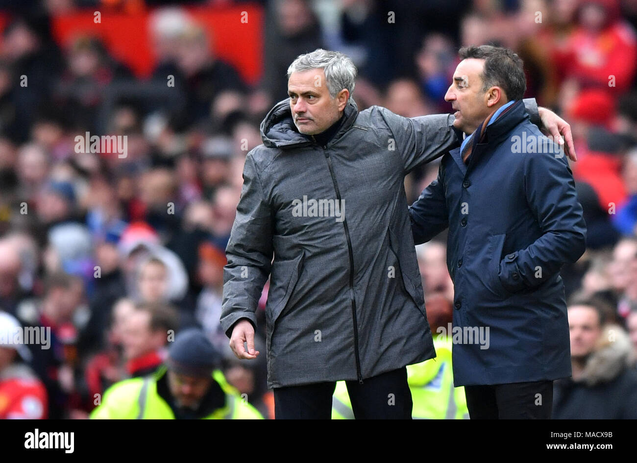 Manchester United manager Jose Mourinho (left) and Swansea City manager ...