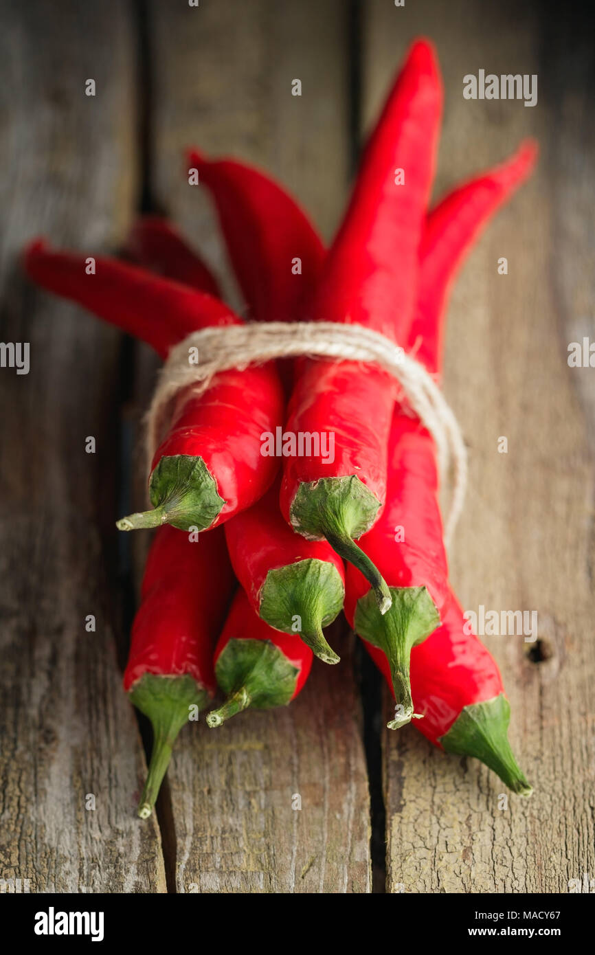 Red hot chili peppers over wooden old boards. Rustic style Stock Photo ...