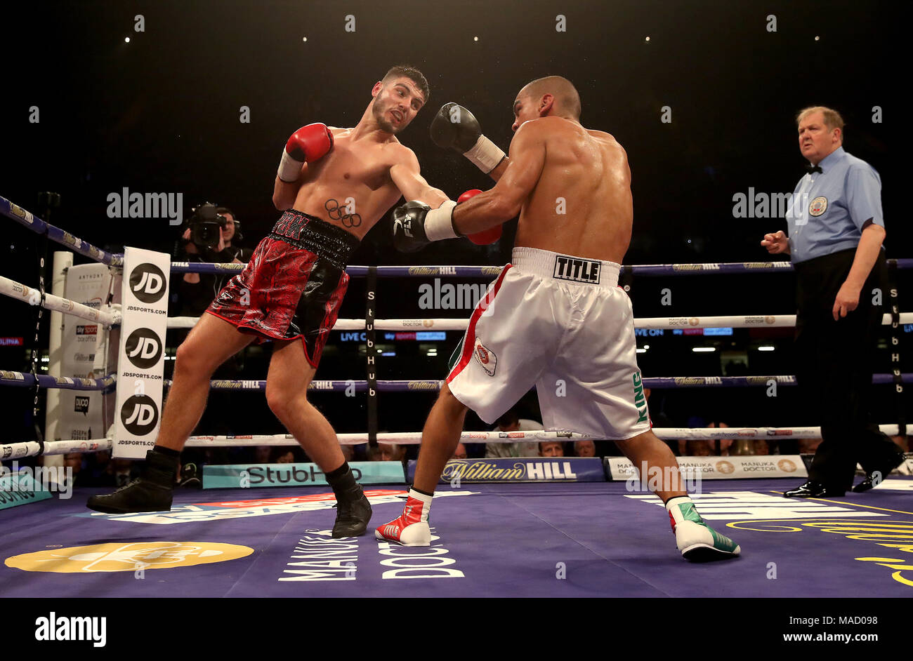 Josh Kelly (left) in action against Carlos Molina in their WBA ...