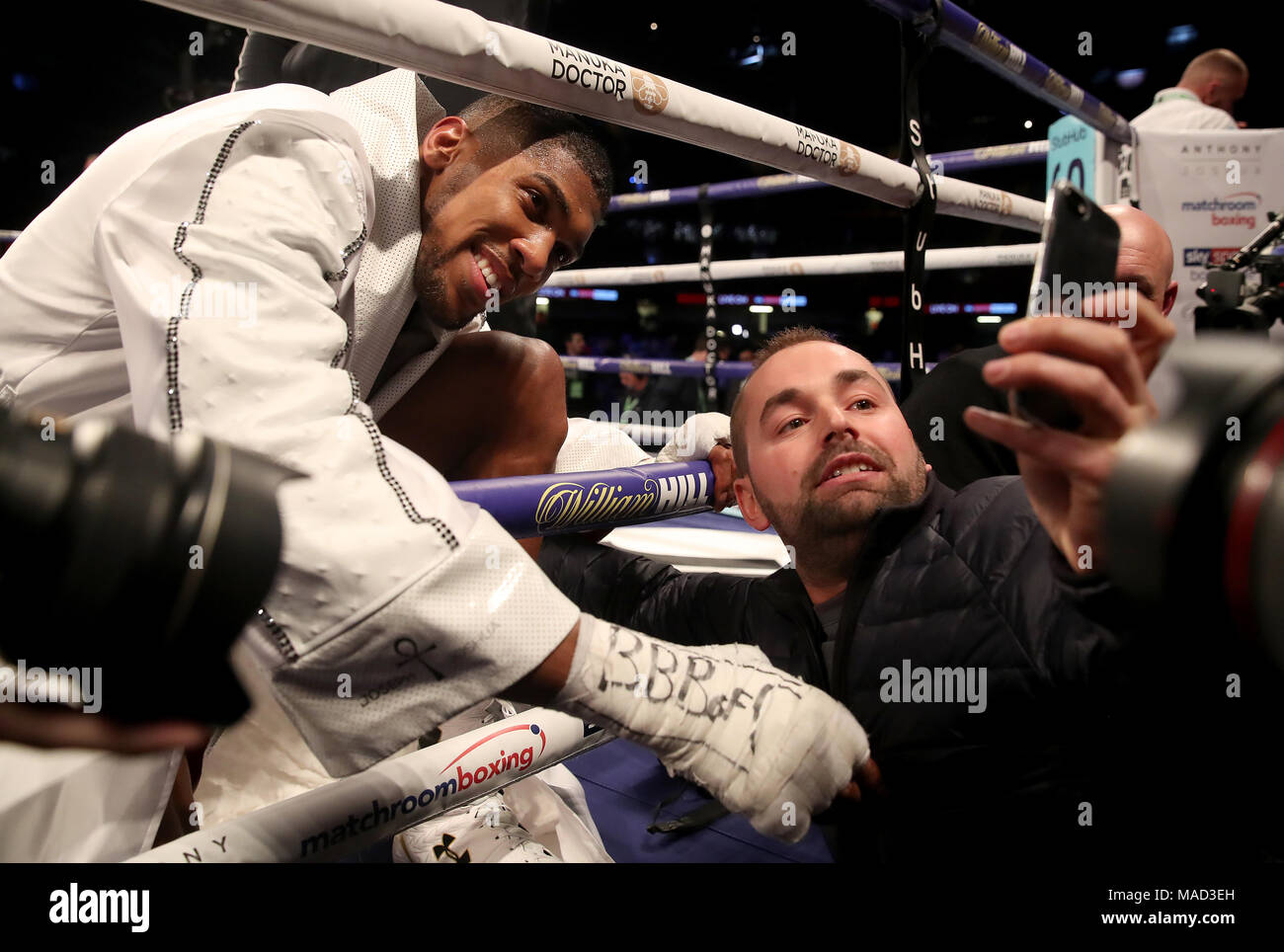 Anthony Joshua poses for photographs after victory over Joseph Parker ...