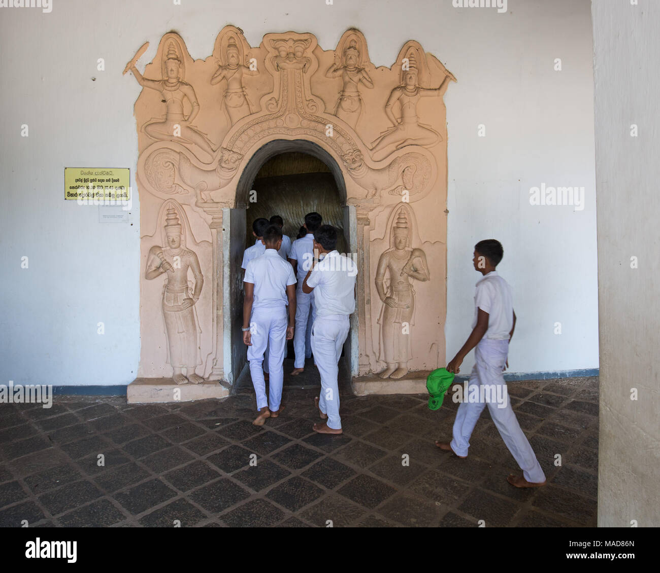School students entering inside Dambulla Cave Temple, Dambulla, Sri ...