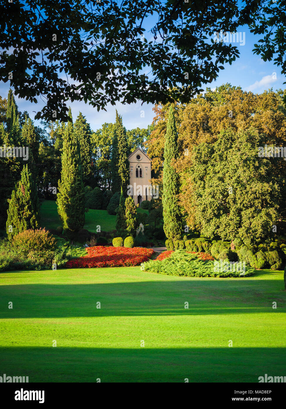 Small church in the trees and a huge green lawn Stock Photo - Alamy