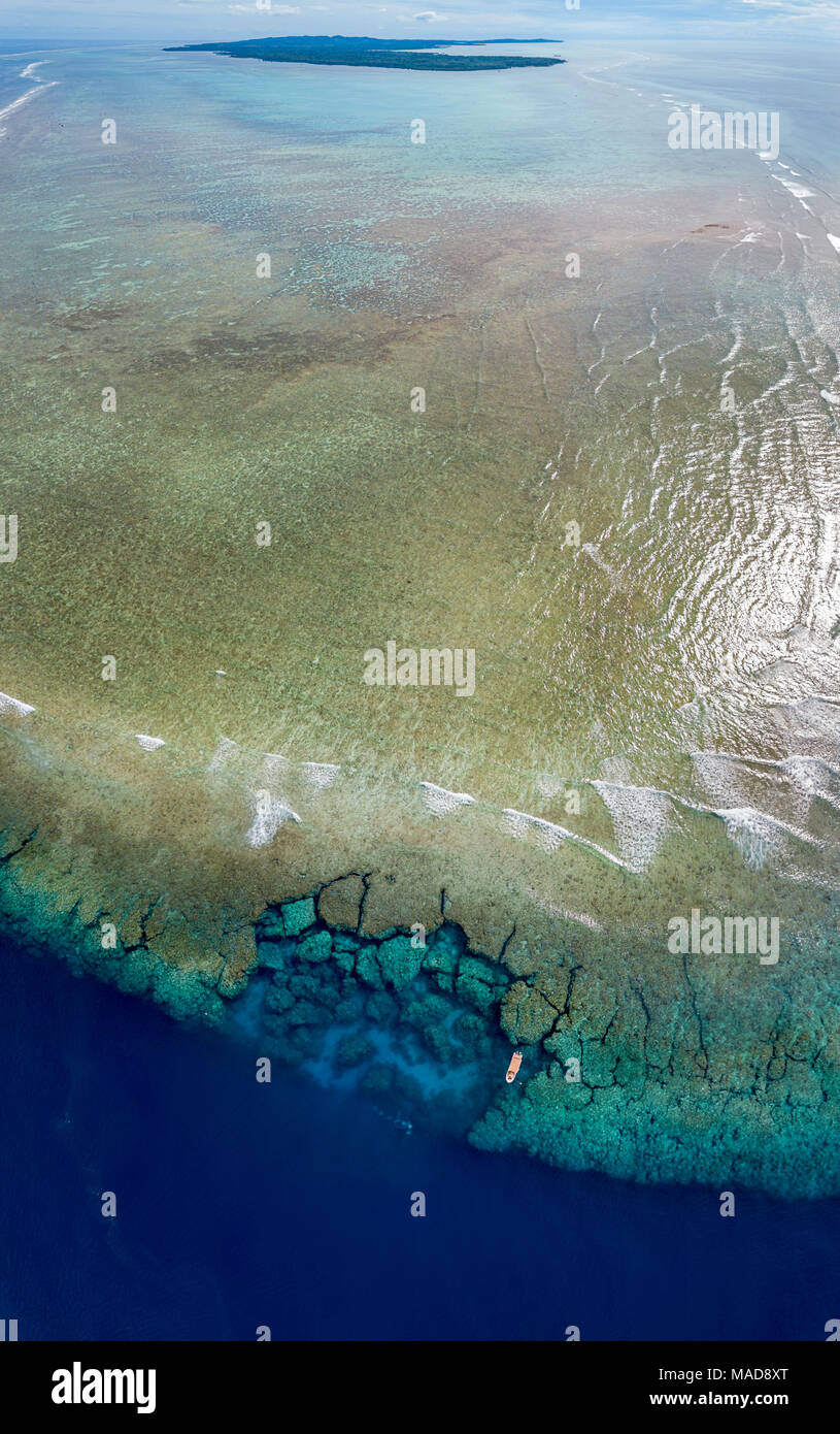 An aerial view of the southern end of the reef surrounding the island ...
