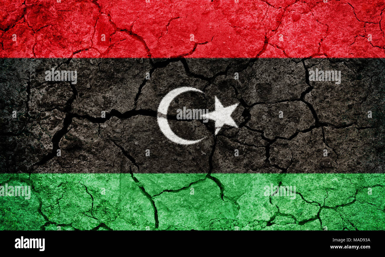 State of Libya flag on dry earth ground texture background Stock Photo ...