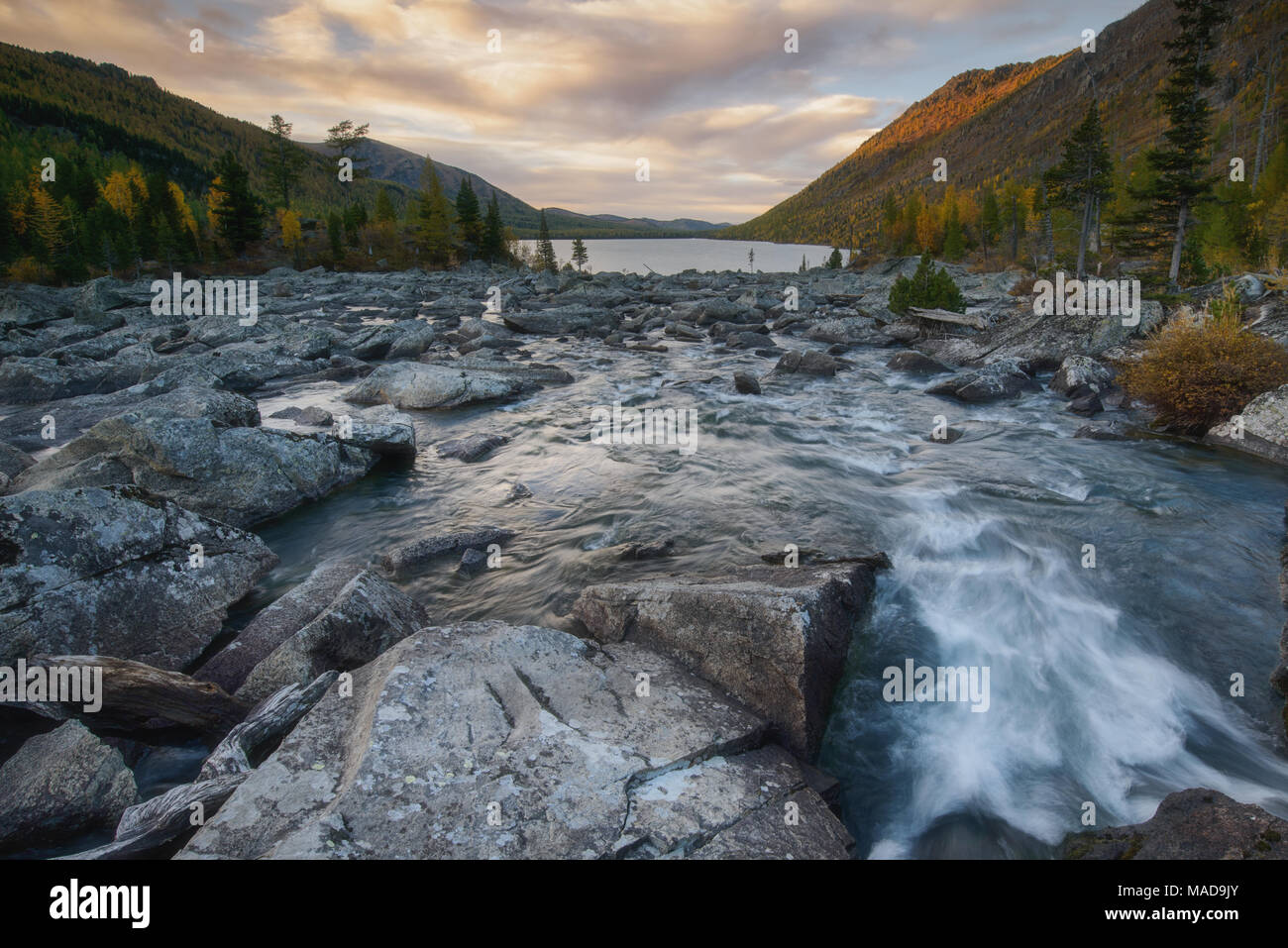 Stream of water flowing into the Lower Lake of Multin, Altay Stock ...