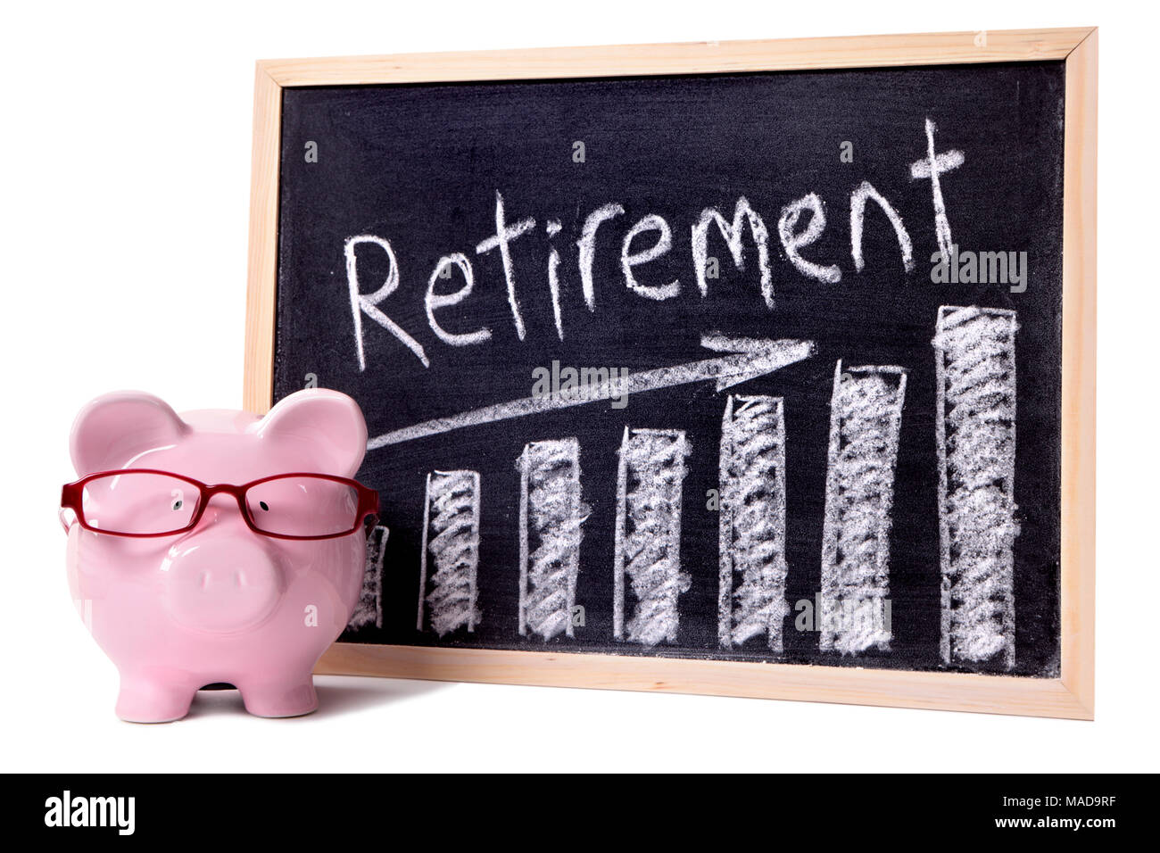 Pink piggy bank with glasses standing next to a blackboard with ...