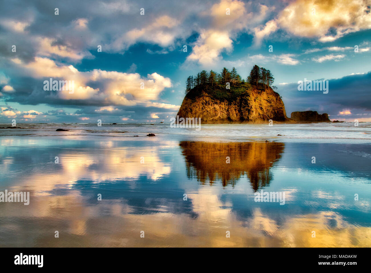 Low tide reflection of Crying Lady Rock at Second Beach. Olympic ...