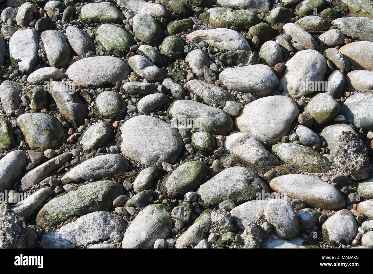 Nice background image of pebbles, round rocks texture Stock Photo - Alamy