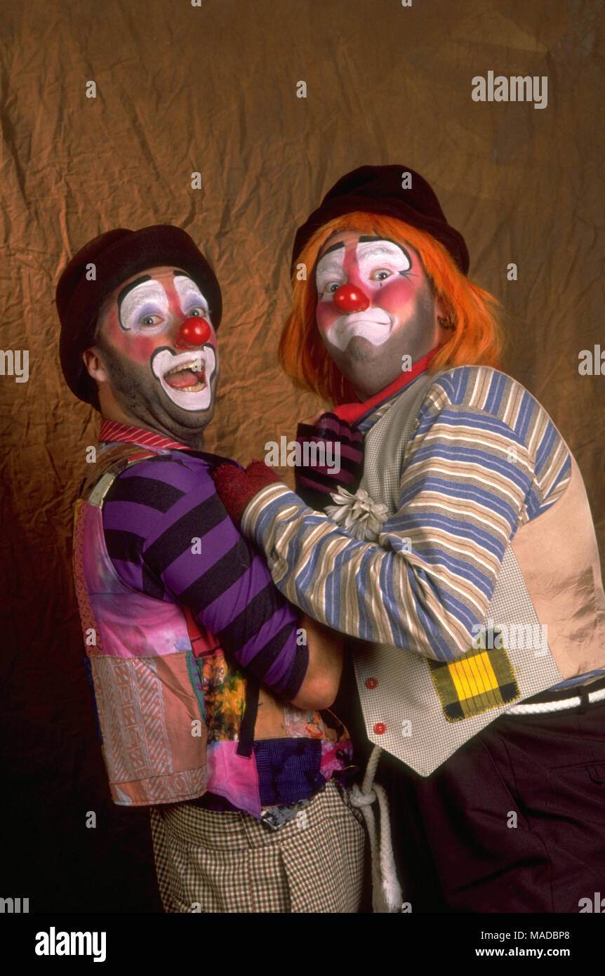 2 Hobo clowns arguing and laughing in a studio shot Stock Photo - Alamy