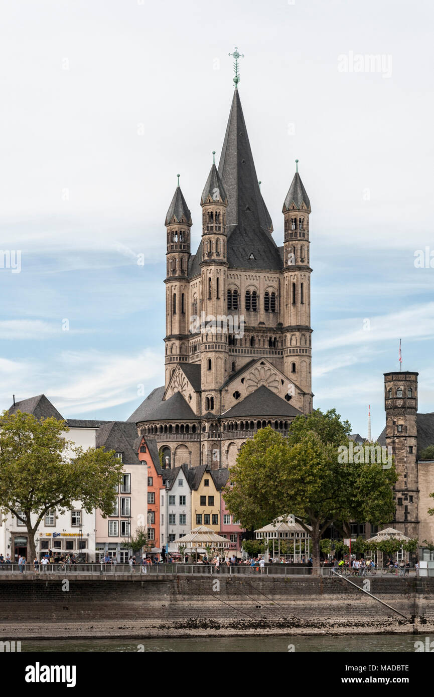 Colorful houses in Bavarian style and the Romanesque Catholic church ...