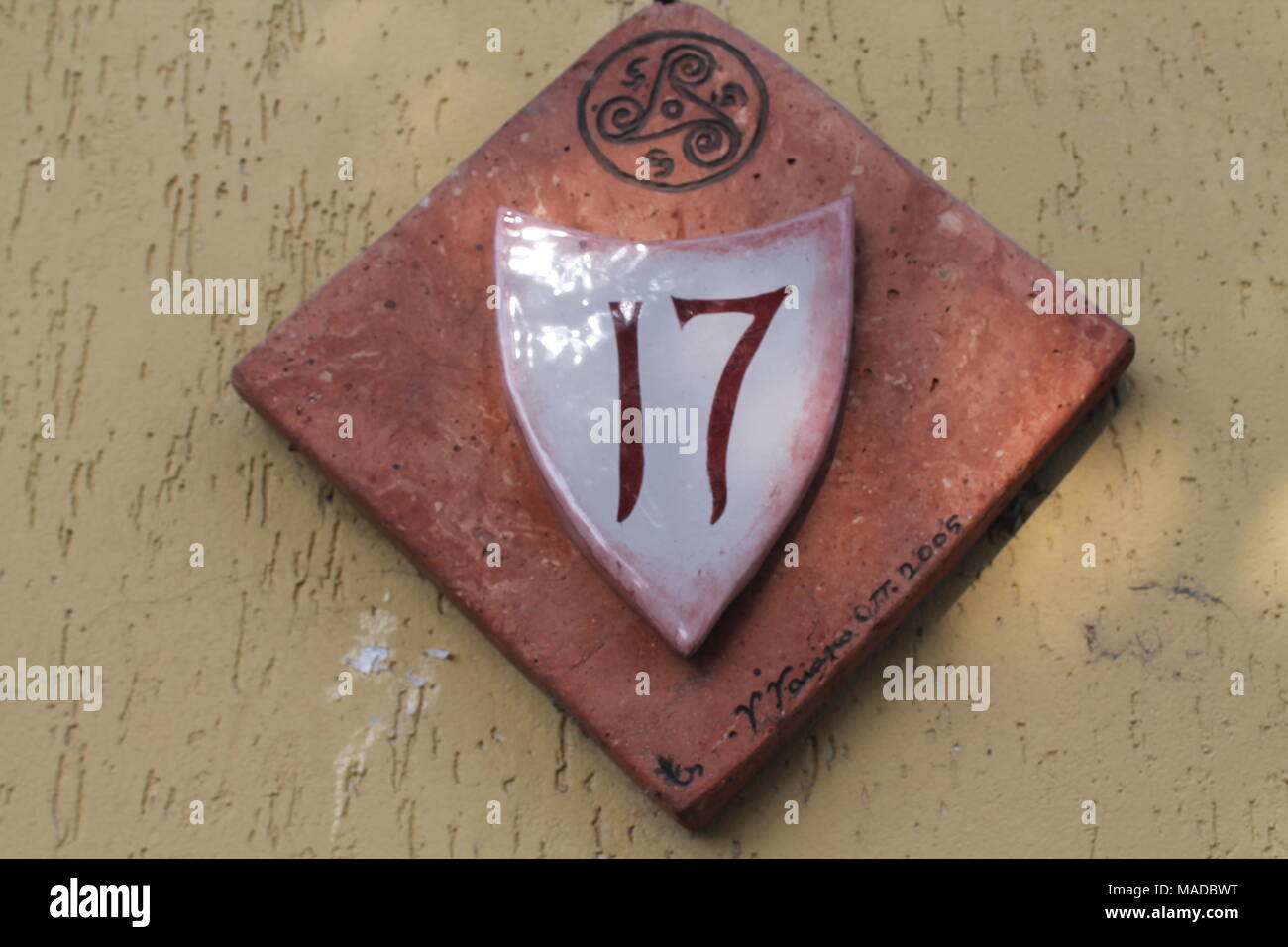 Rustic number 17 sign, on a stone marker , on a walking trail Stock ...