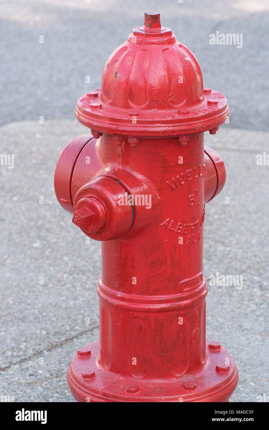 red fire hydrant on street curb Stock Photo - Alamy