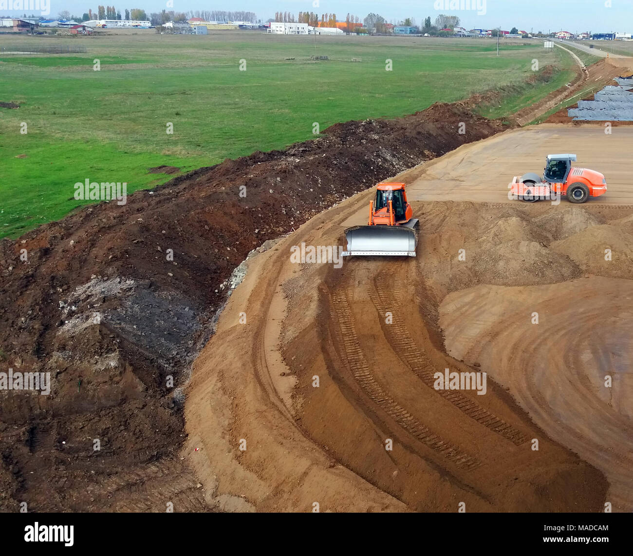 Bulldozer and compactor Stock Photo - Alamy