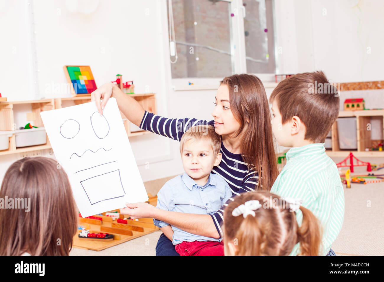 Teacher sitting children circle hi-res stock photography and images - Alamy