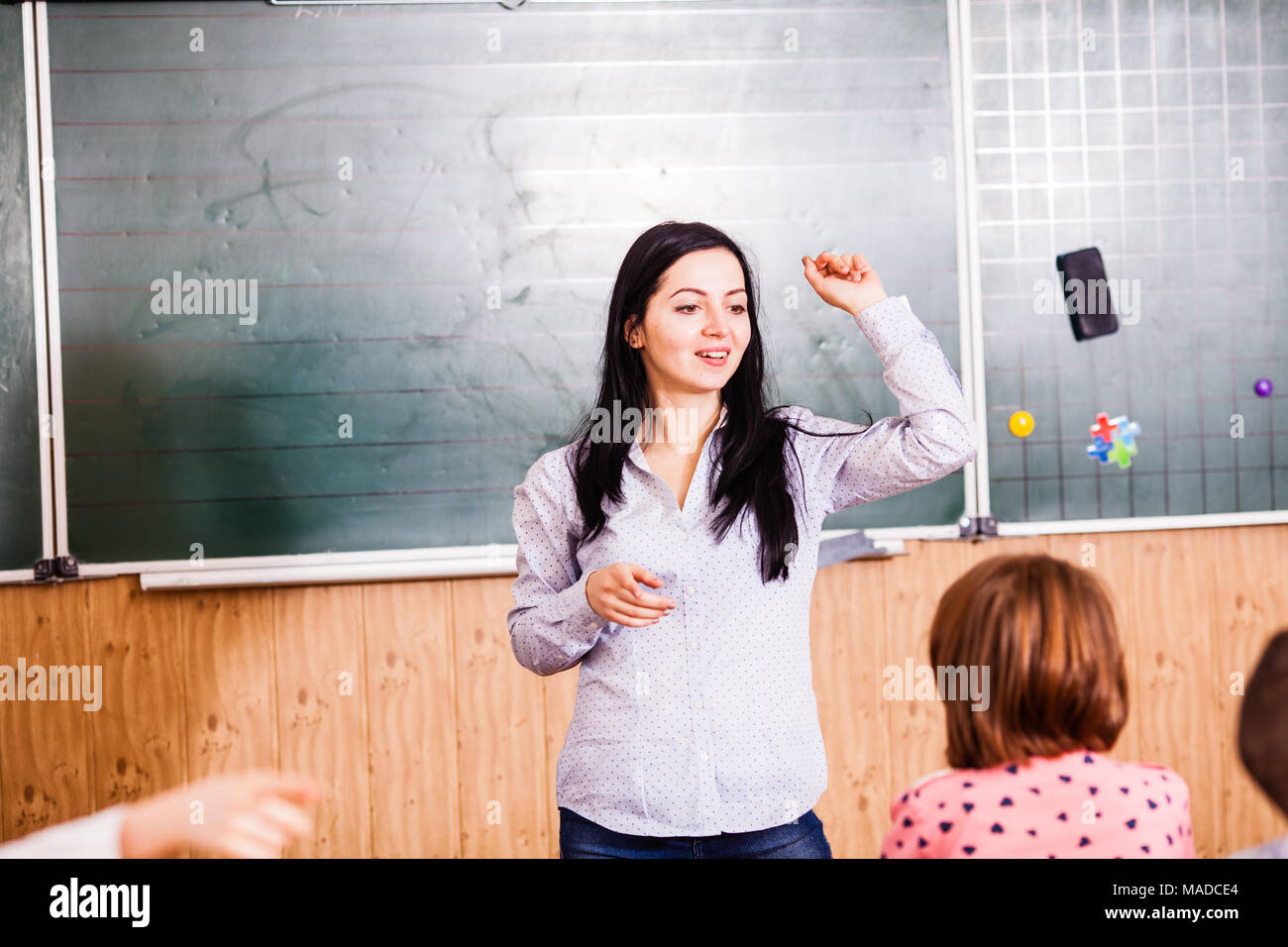 the teacher explains the new material on the lesson Stock Photo - Alamy