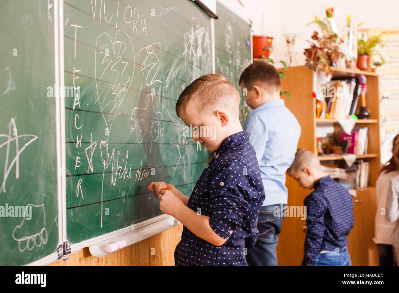 boys want to draw something special Stock Photo - Alamy