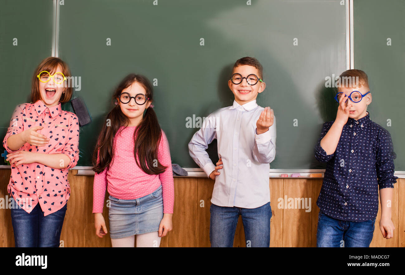 Cool pupils in glasses have fun together during the break Stock Photo ...