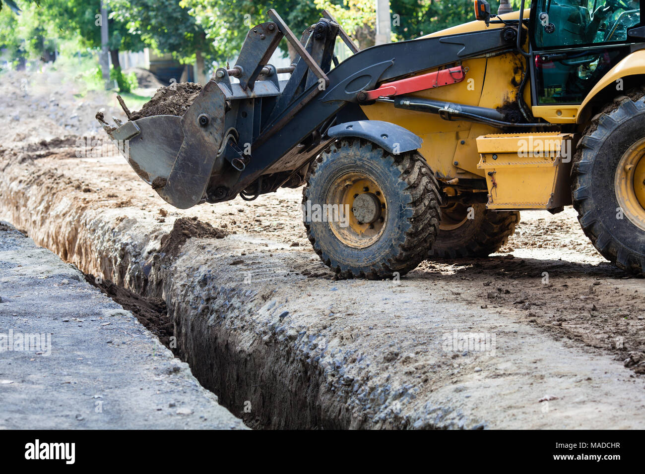 Excavator while working Stock Photo - Alamy