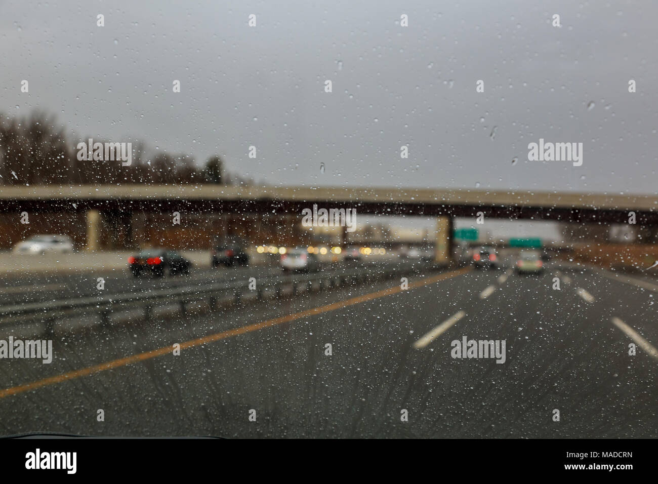 Water drops on the car glass. Car window covered with rain droplets ...