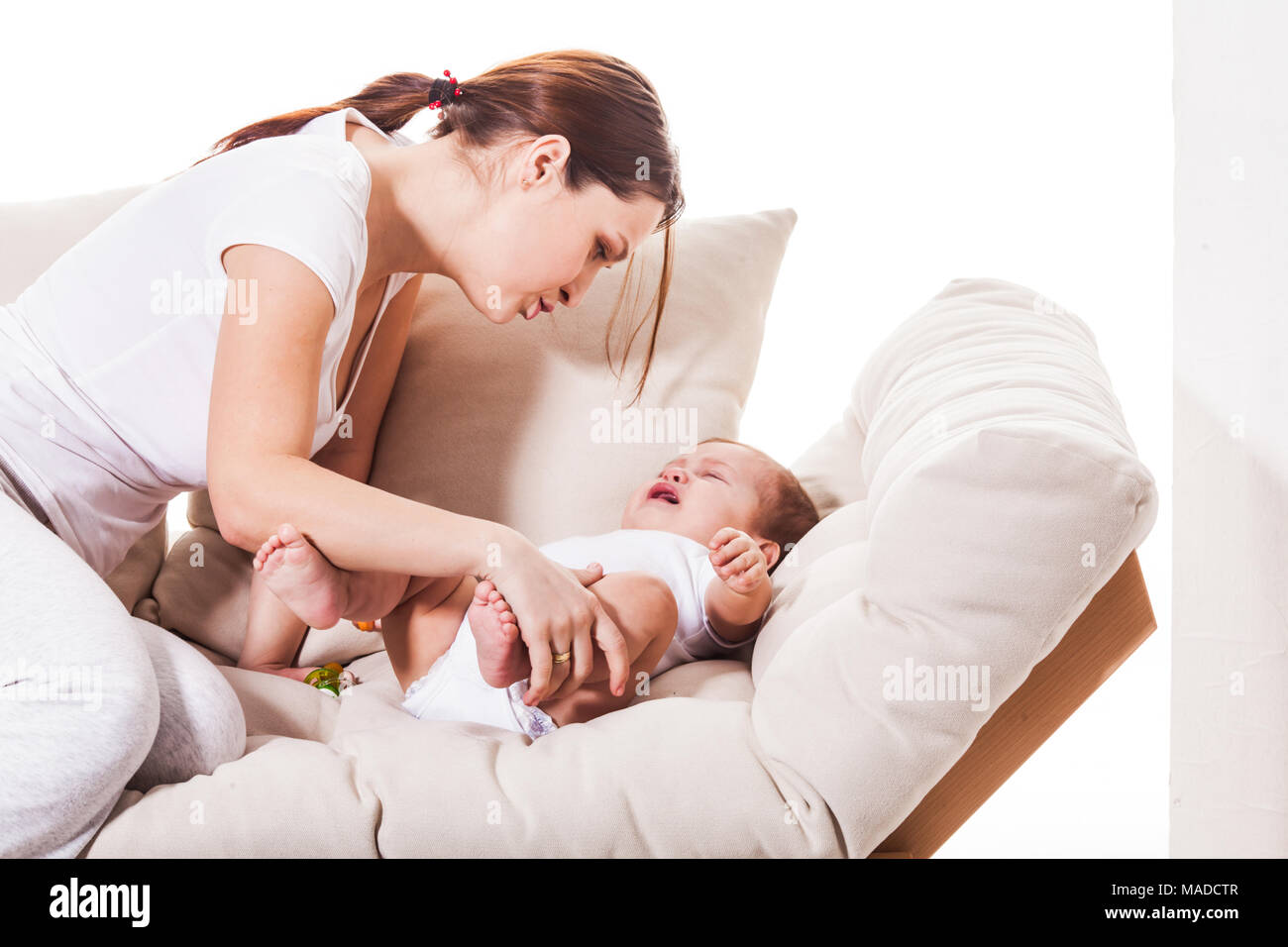 Mother and crying baby Stock Photo - Alamy