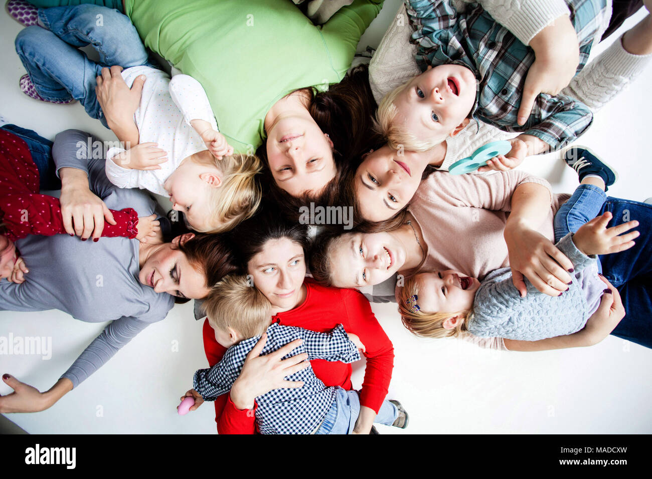 The children with moms Stock Photo - Alamy