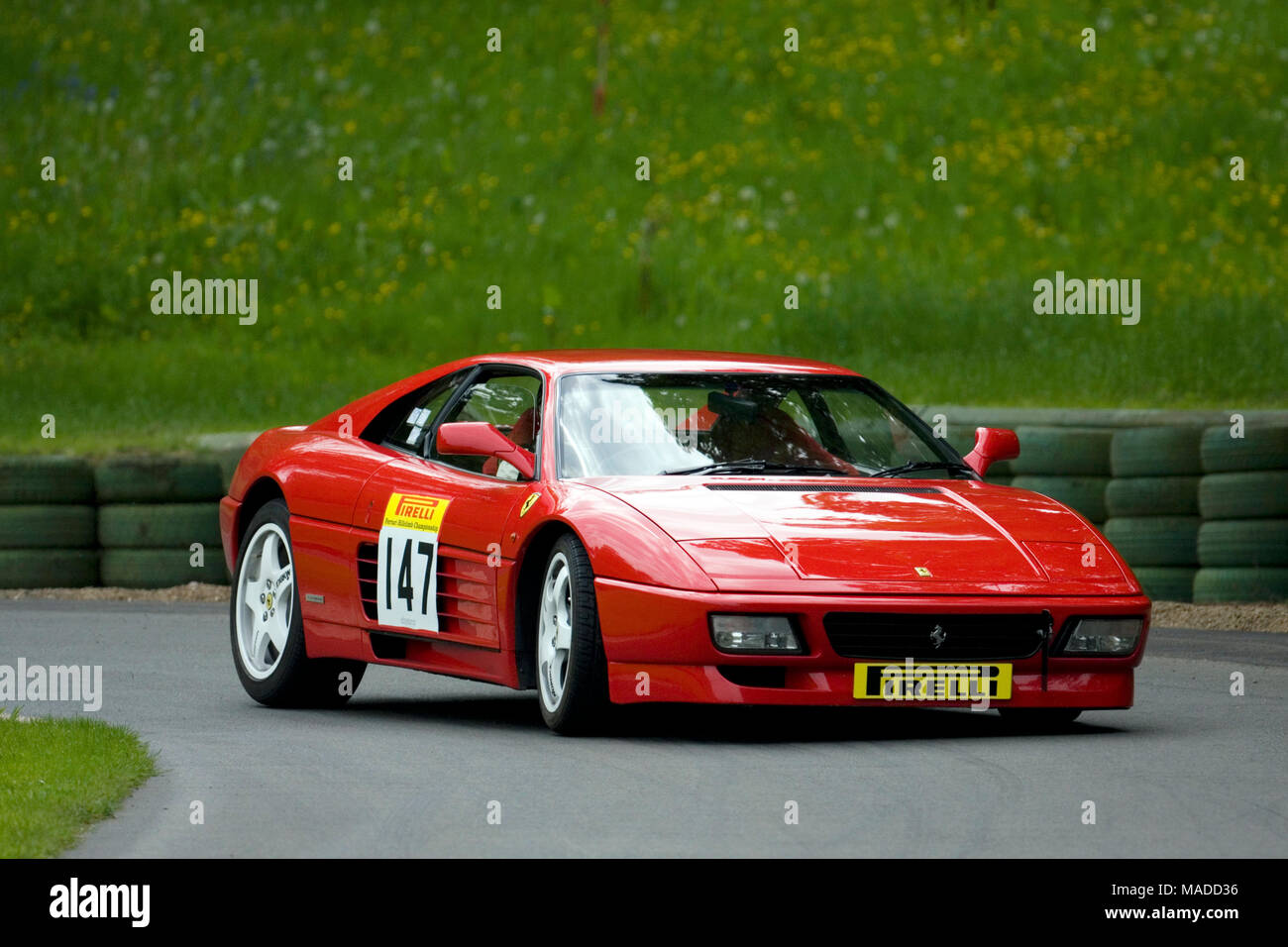 Red Ferrari racing on the Prescott speed hill climb circuit ...