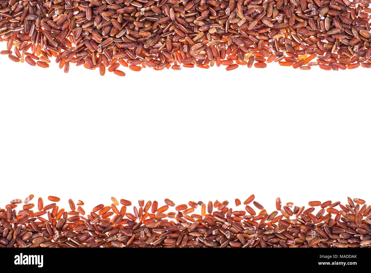 Scattering of red rice on white background closeup. Studio Photo Stock ...
