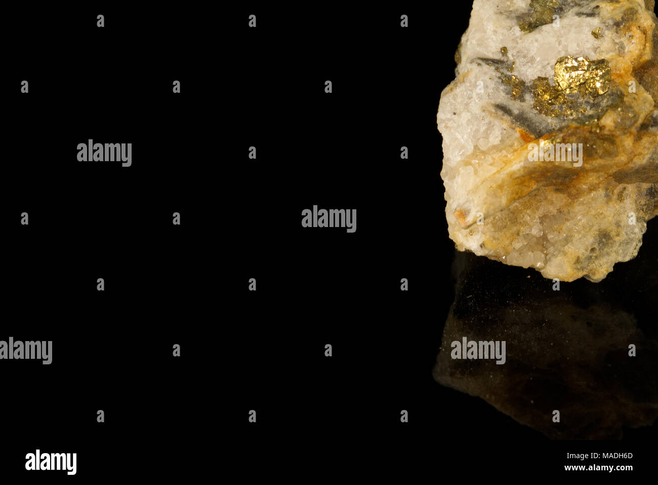 Chalcopyrite copper iron sulfide mineral ore isolated on black ...