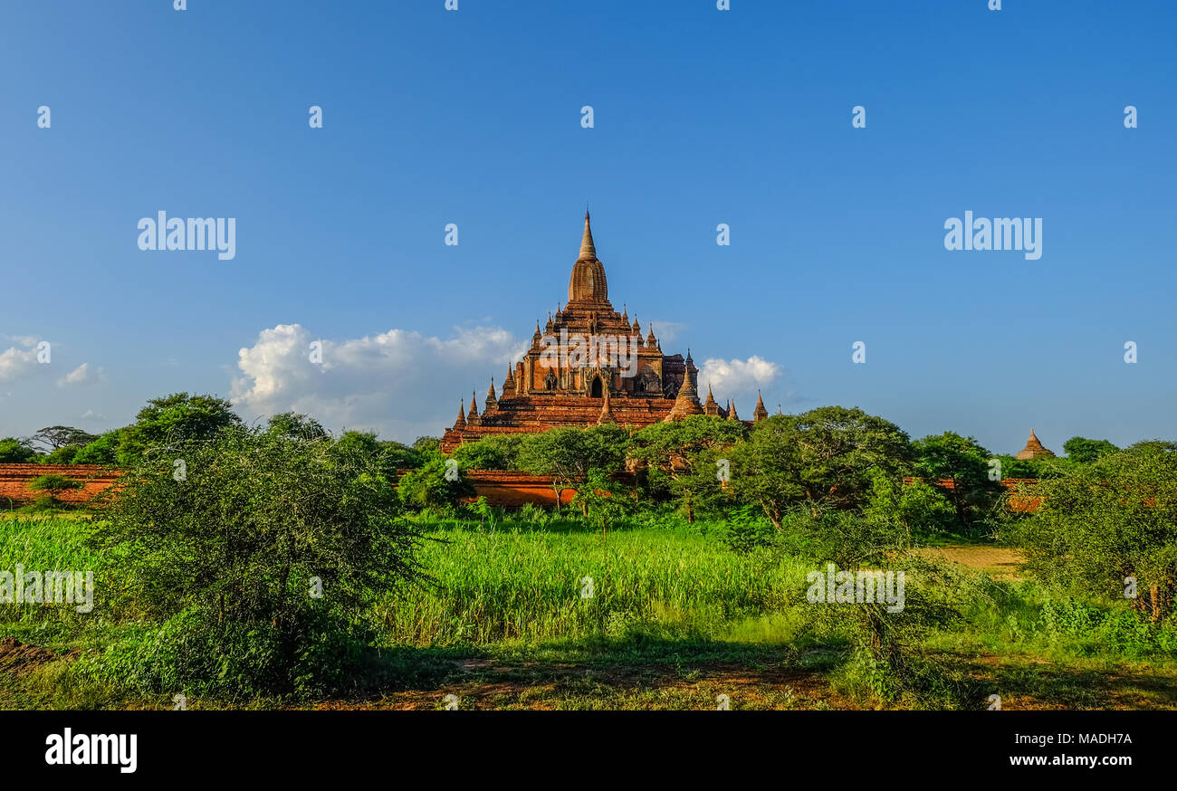 Ancient Buddhist pagodas at summer day in Bagan, Myanmar Stock Photo ...