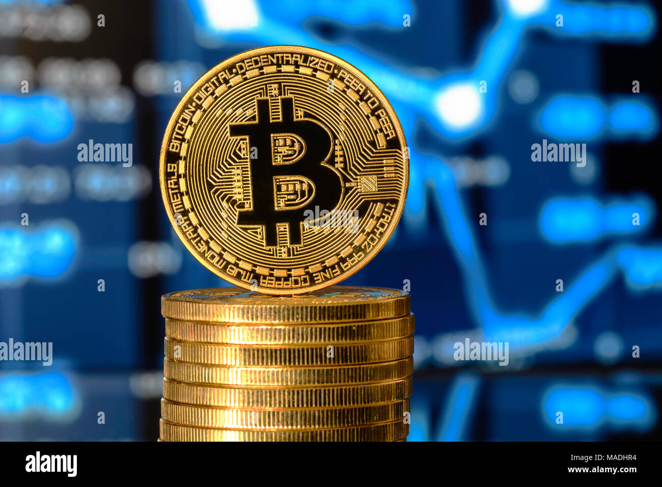 Bitcoin on top of Money stack, against blurry background Stock Photo ...