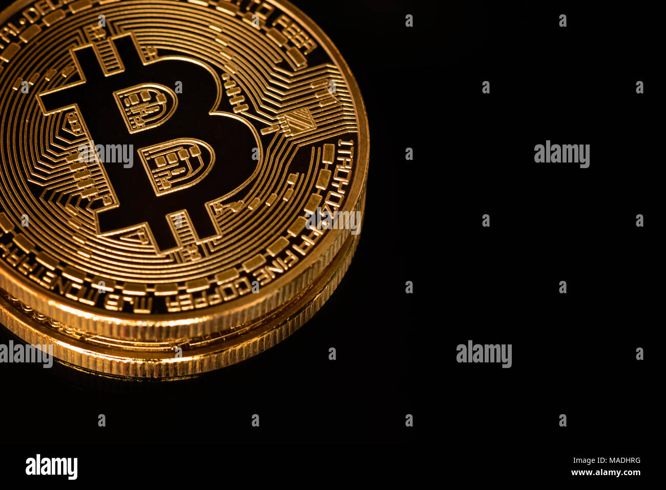 Bitcoin close up isolated on black background Stock Photo - Alamy