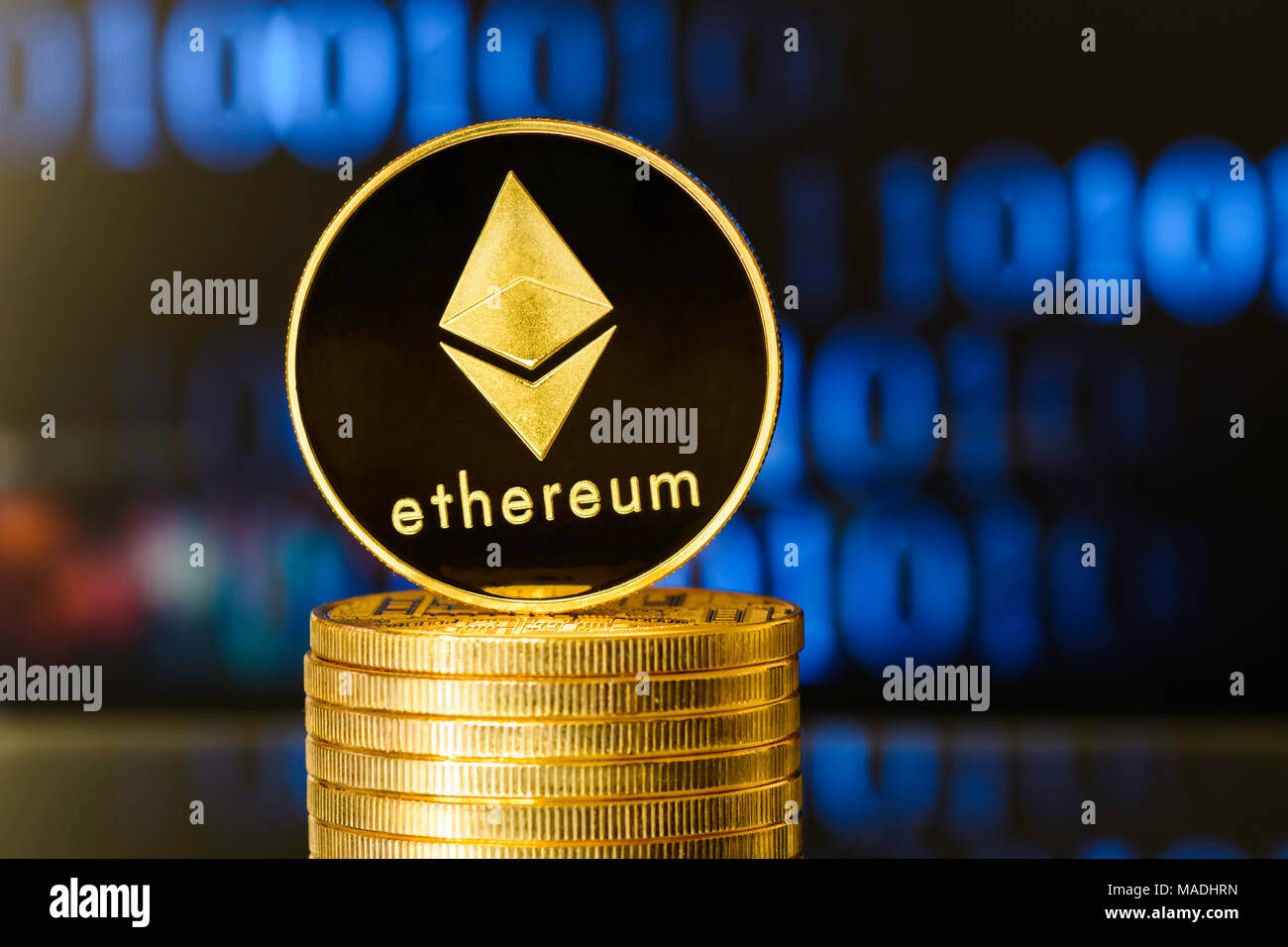 Ethereum on top of Money stack, against blurry background Stock Photo ...