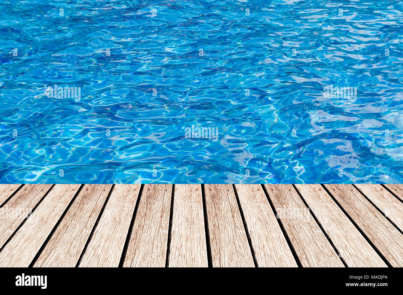 Wood table top on Surface water in pool background - can be used for ...