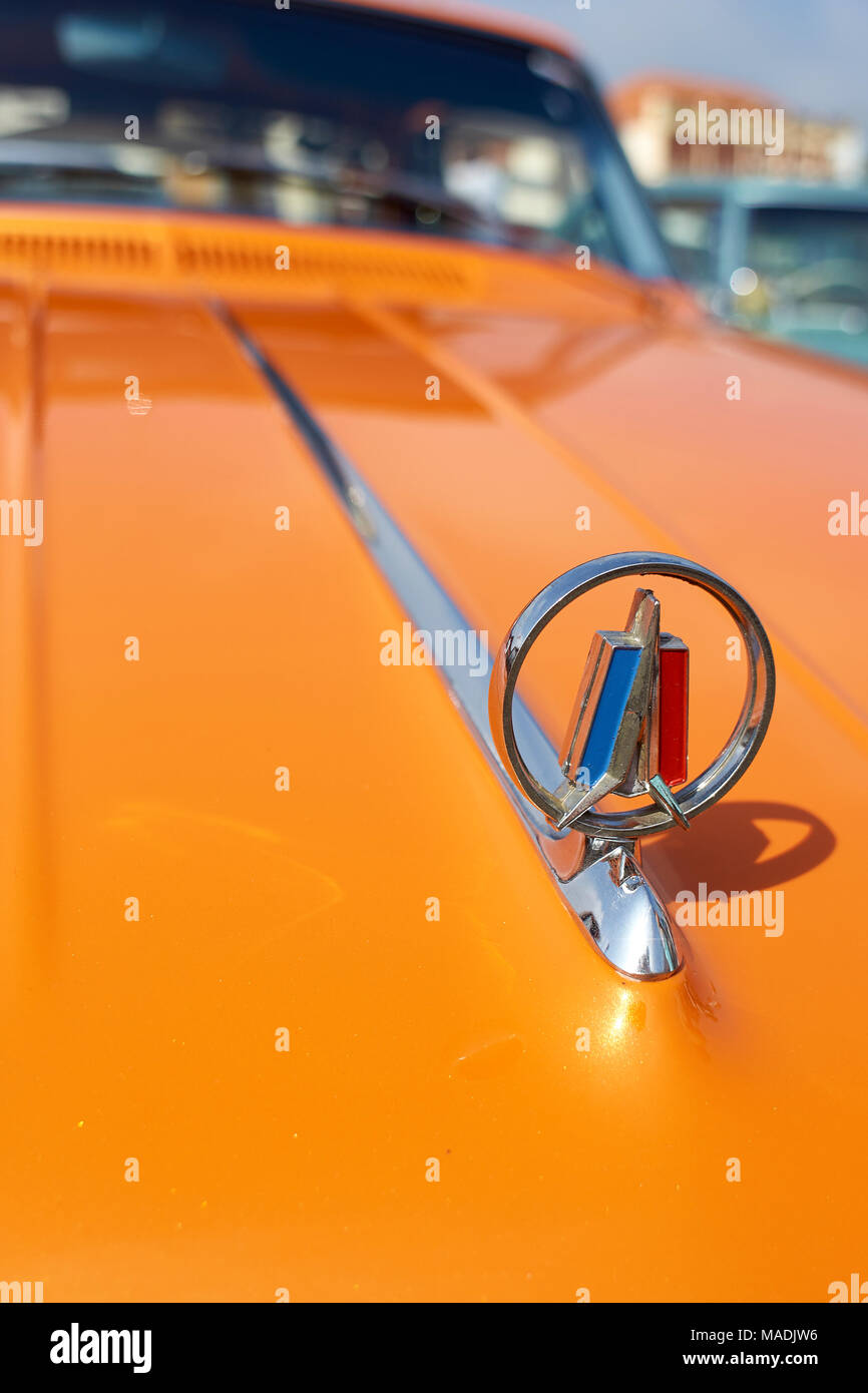 Chrysler Valiant hood emblem against an orange hood Stock Photo - Alamy