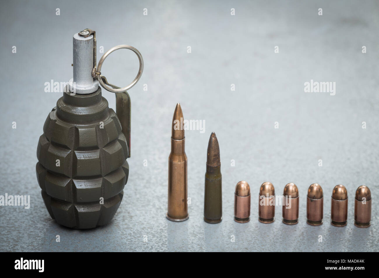Hand grenade, cartridges and scales from various types of weapons Stock ...